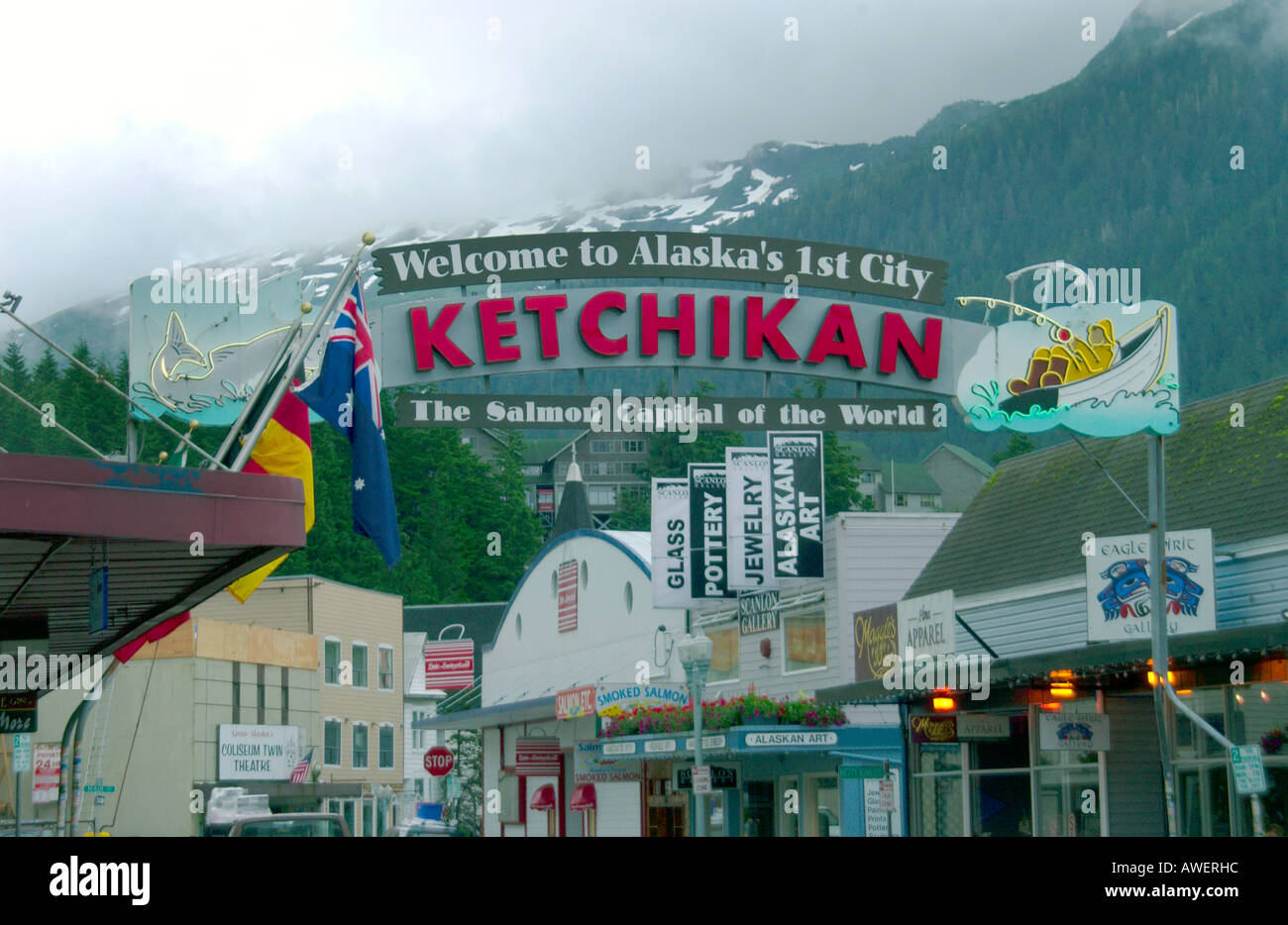 A famous town sign welcoming tourists to Ketchikan, Alaska hangs over a ...