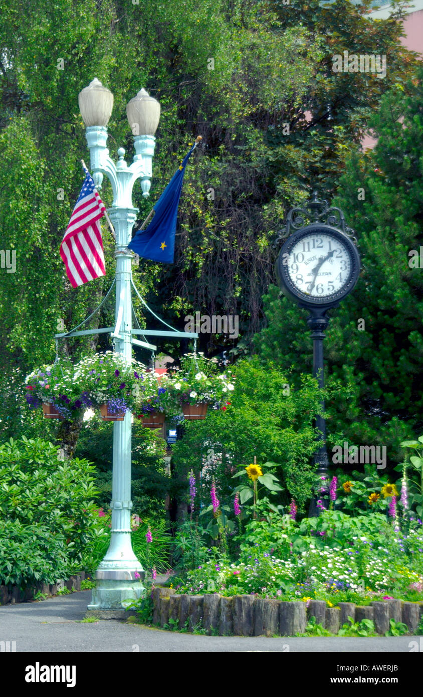 Lamp post, American flag and clock in a small park in Ketchikan, Alaska ...
