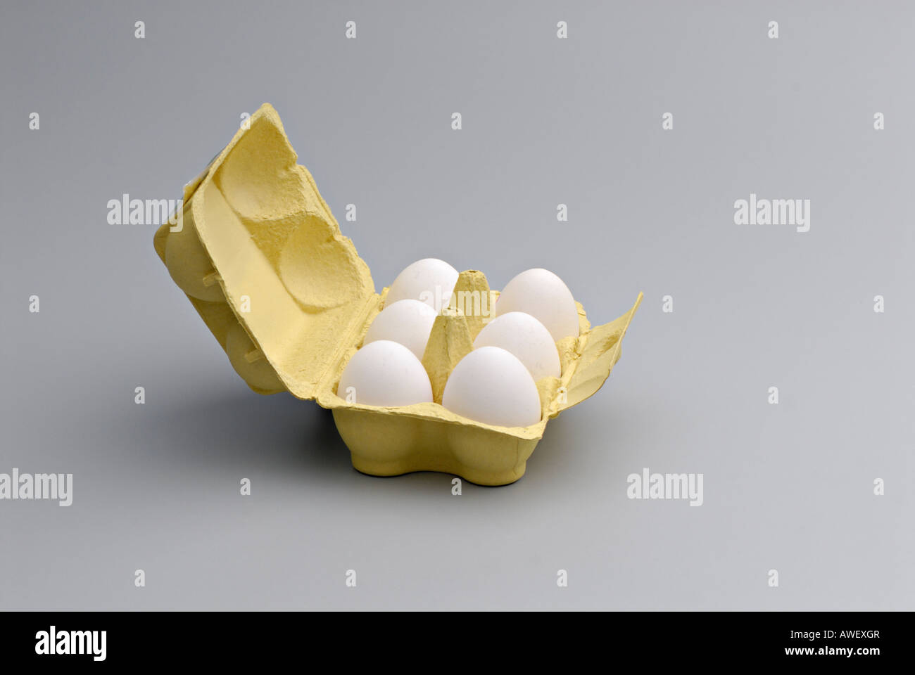 Six white eggs in open cardboard egg box Stock Photo - Alamy