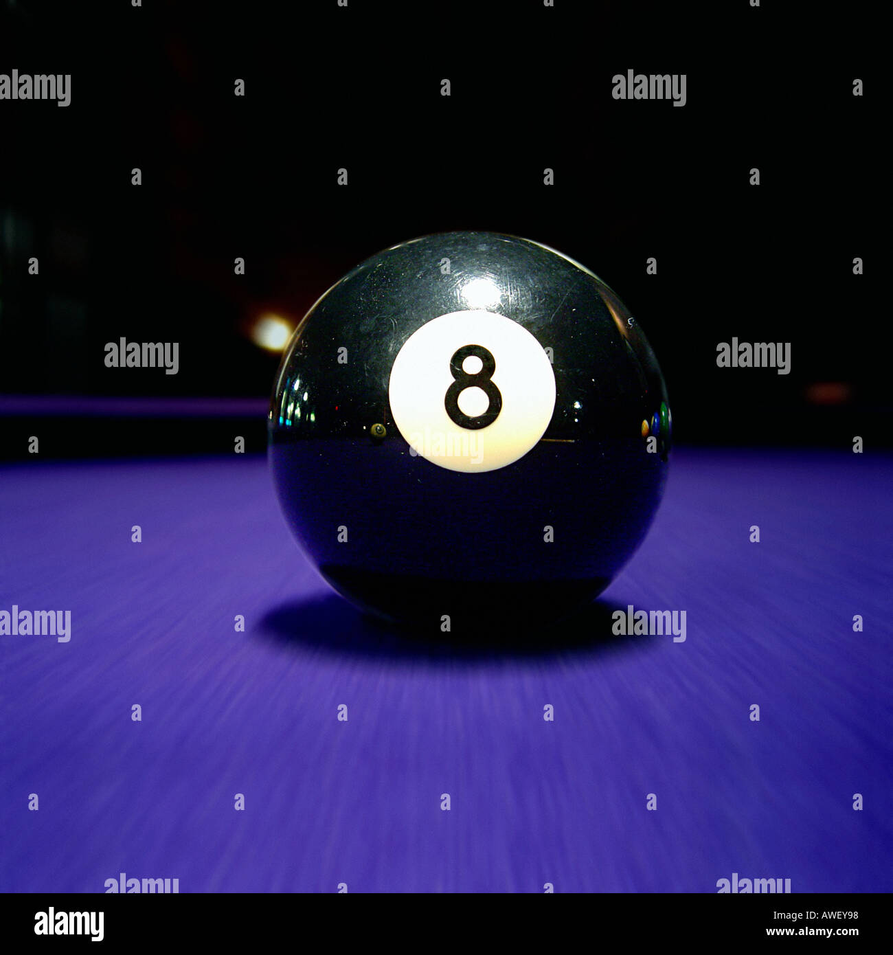 Closeup of Eight Ball 8 Ball on Pool Billiards Table with Purple Felt ...