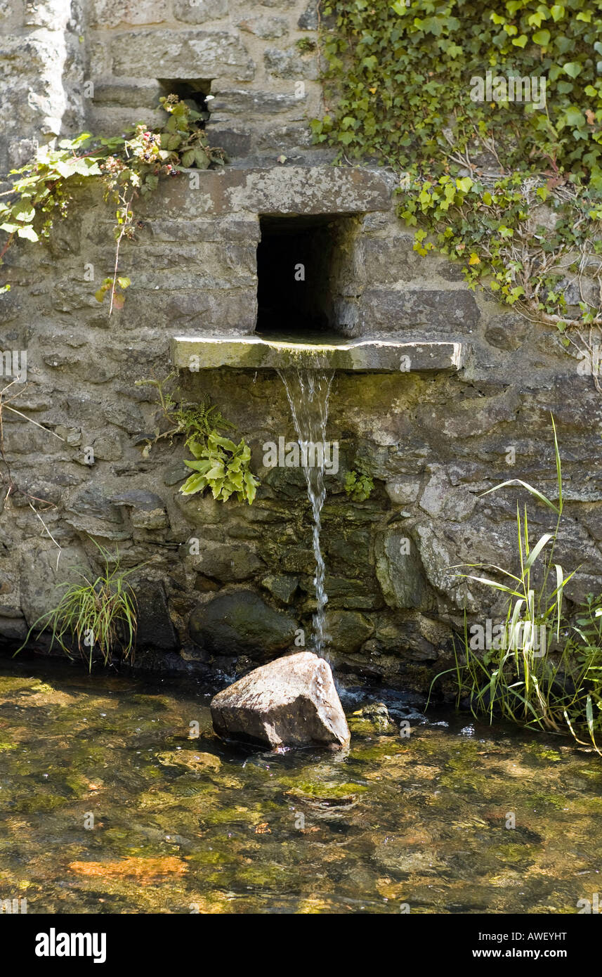 Water flowing into a brook through a drainage channel Stock Photo - Alamy