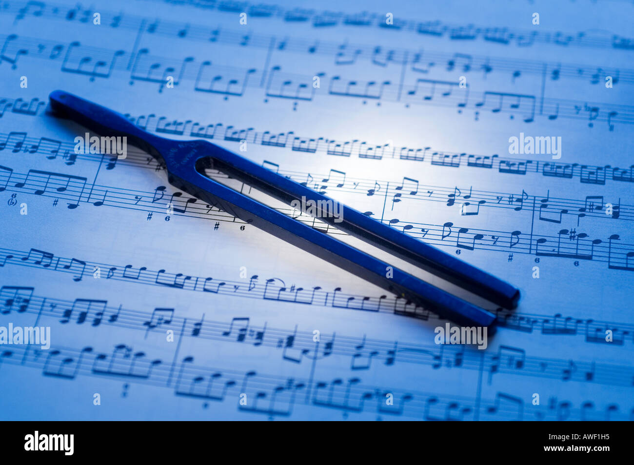 tuning fork with sheet music Stock Photo - Alamy