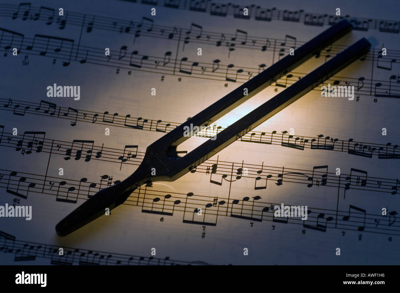 tuning fork with sheet music Stock Photo - Alamy