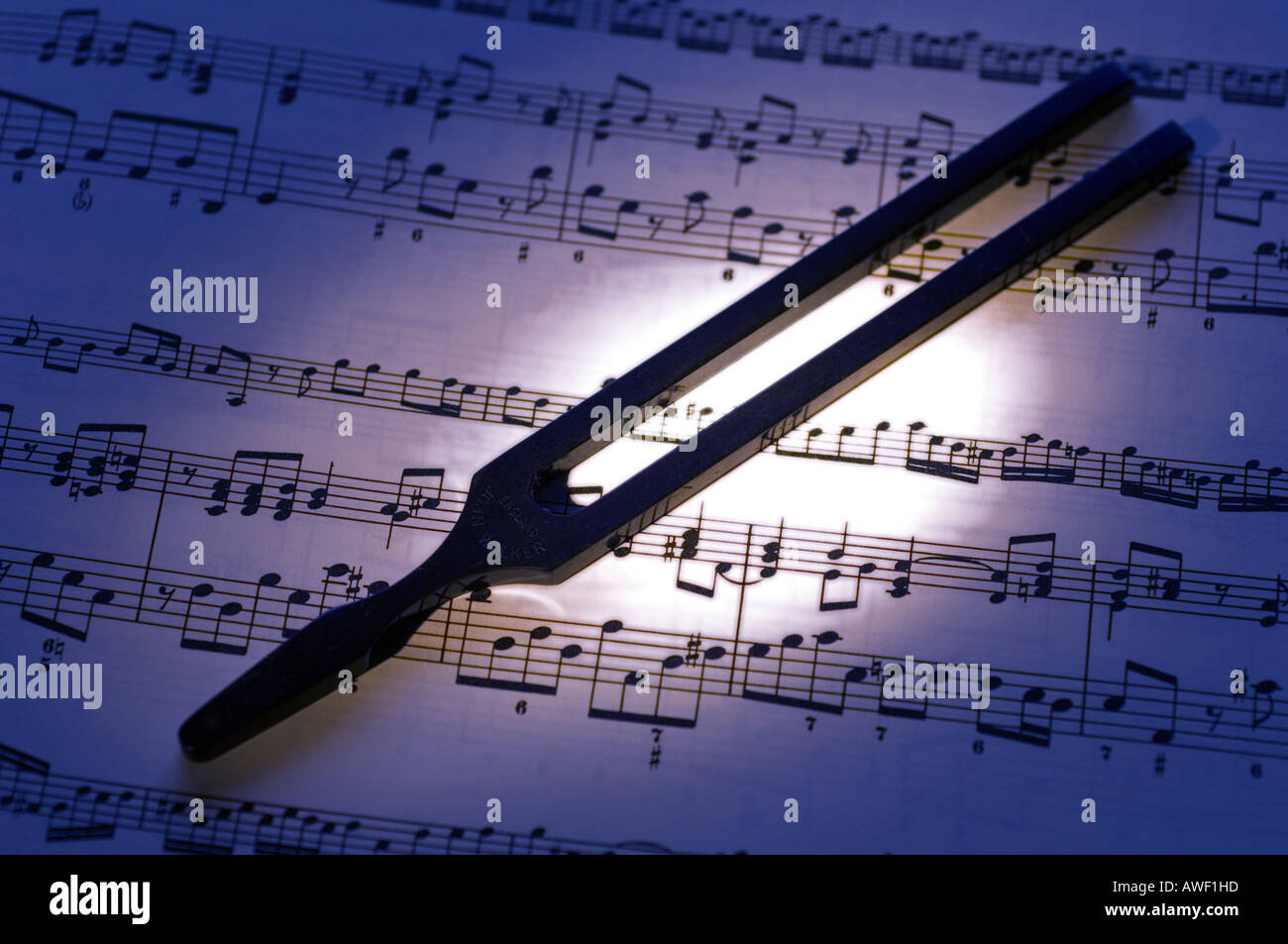 tuning fork with sheet music Stock Photo - Alamy