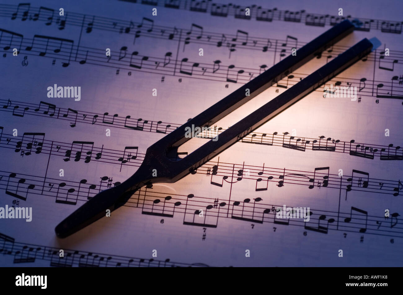 tuning fork with sheet music Stock Photo - Alamy