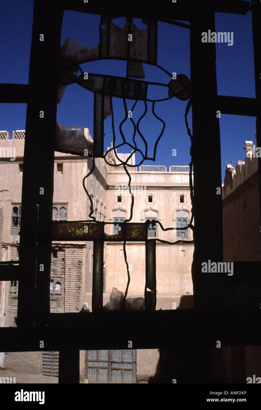 Decrepit Art Noveau window frame in a Javanese baroque mudbrick palace ...