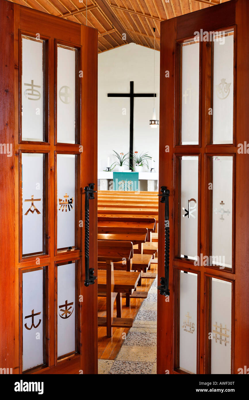 Symbols, glass doors opening toward the main choir of the Protestant ...