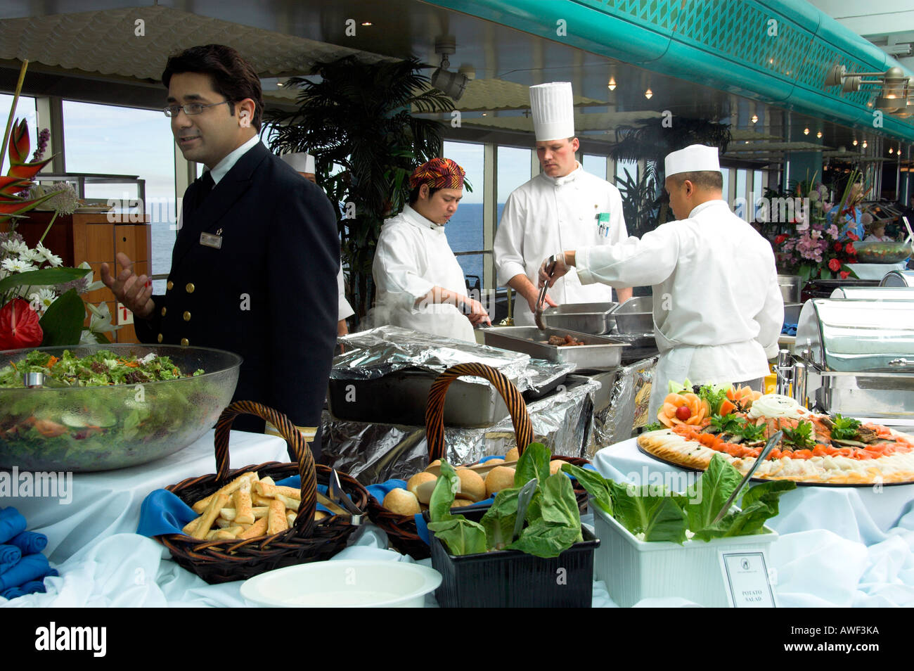 A chef on the Holland America cruise ship Zuiderdam preparing food for ...