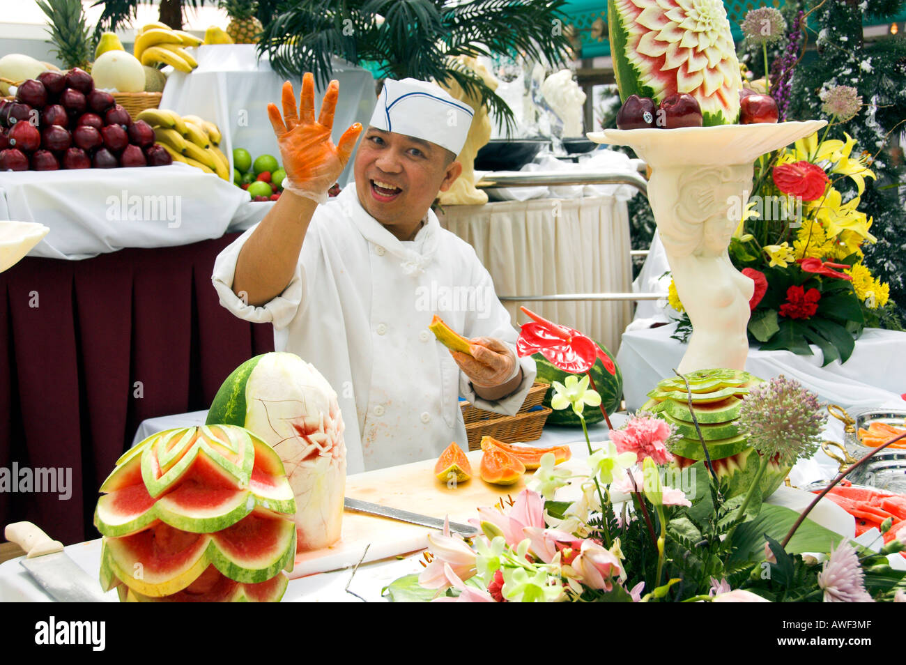 A chef on the Holland America cruise ship Zuiderdam preparing food for ...