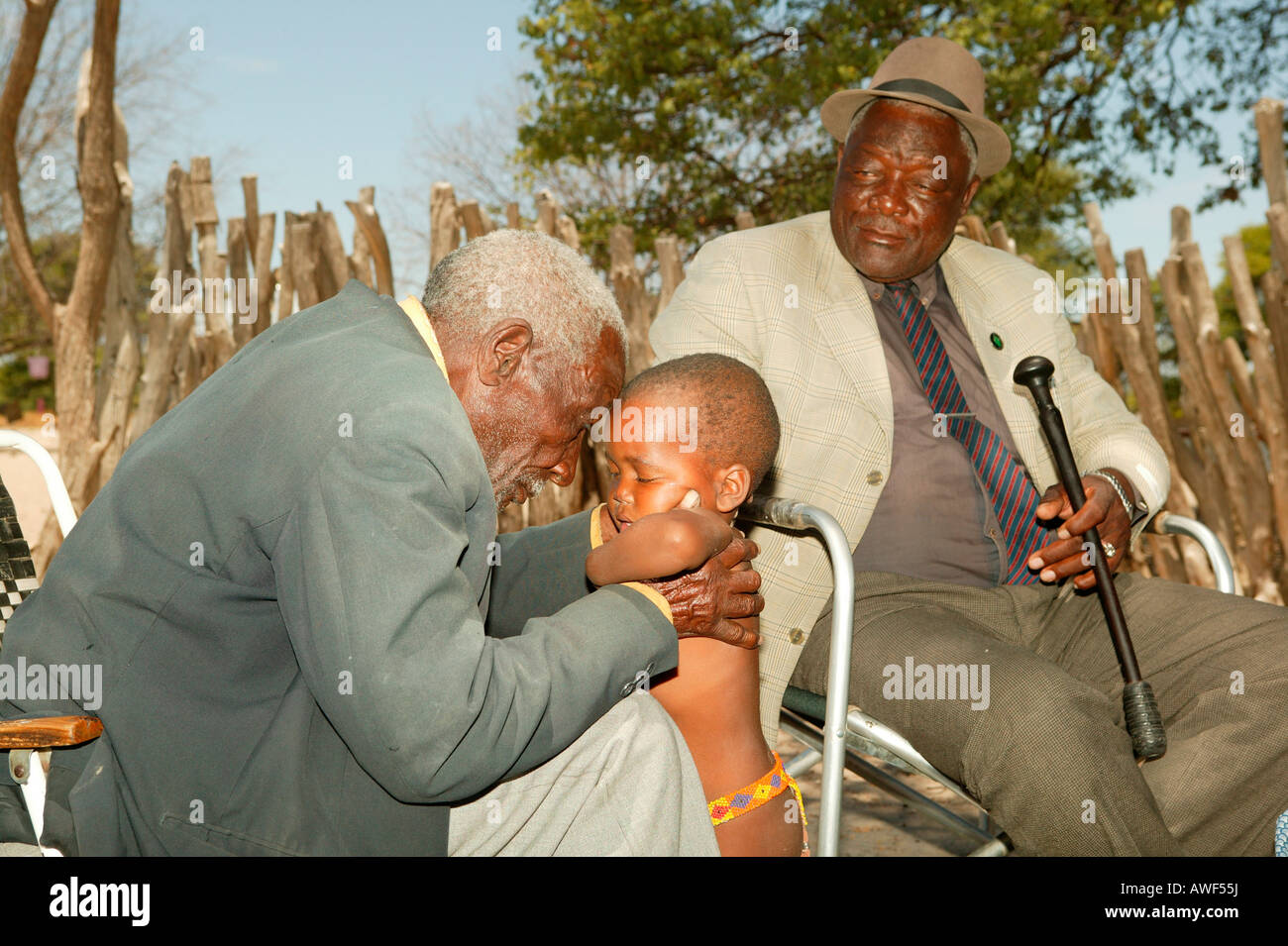 Healer treating a sick child, Sehitwa, Botswana, Africa Stock Photo - Alamy