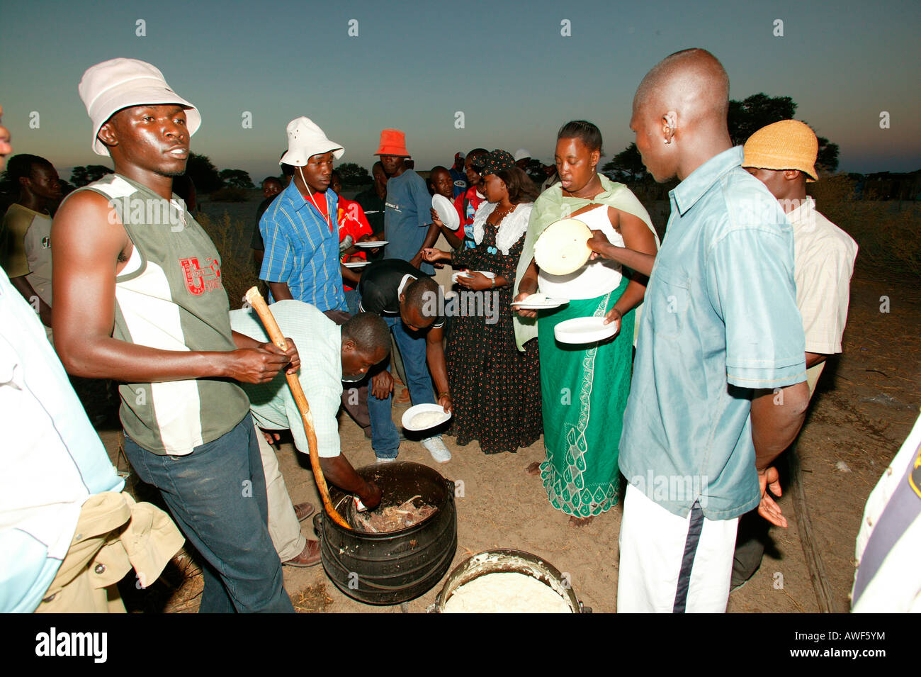 Community gathering under the village tree, Sehitwa, Botswana, Africa ...