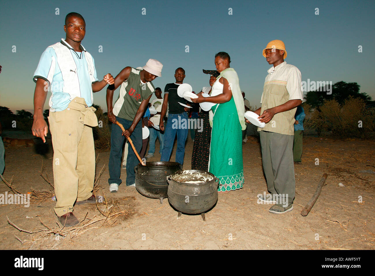Community gathering under the village tree, Sehitwa, Botswana, Africa ...