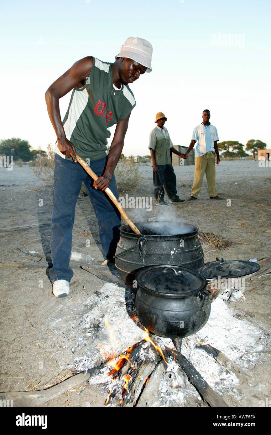 Men cooking in village square, Sehitwa, Botswana, Africa Stock Photo ...