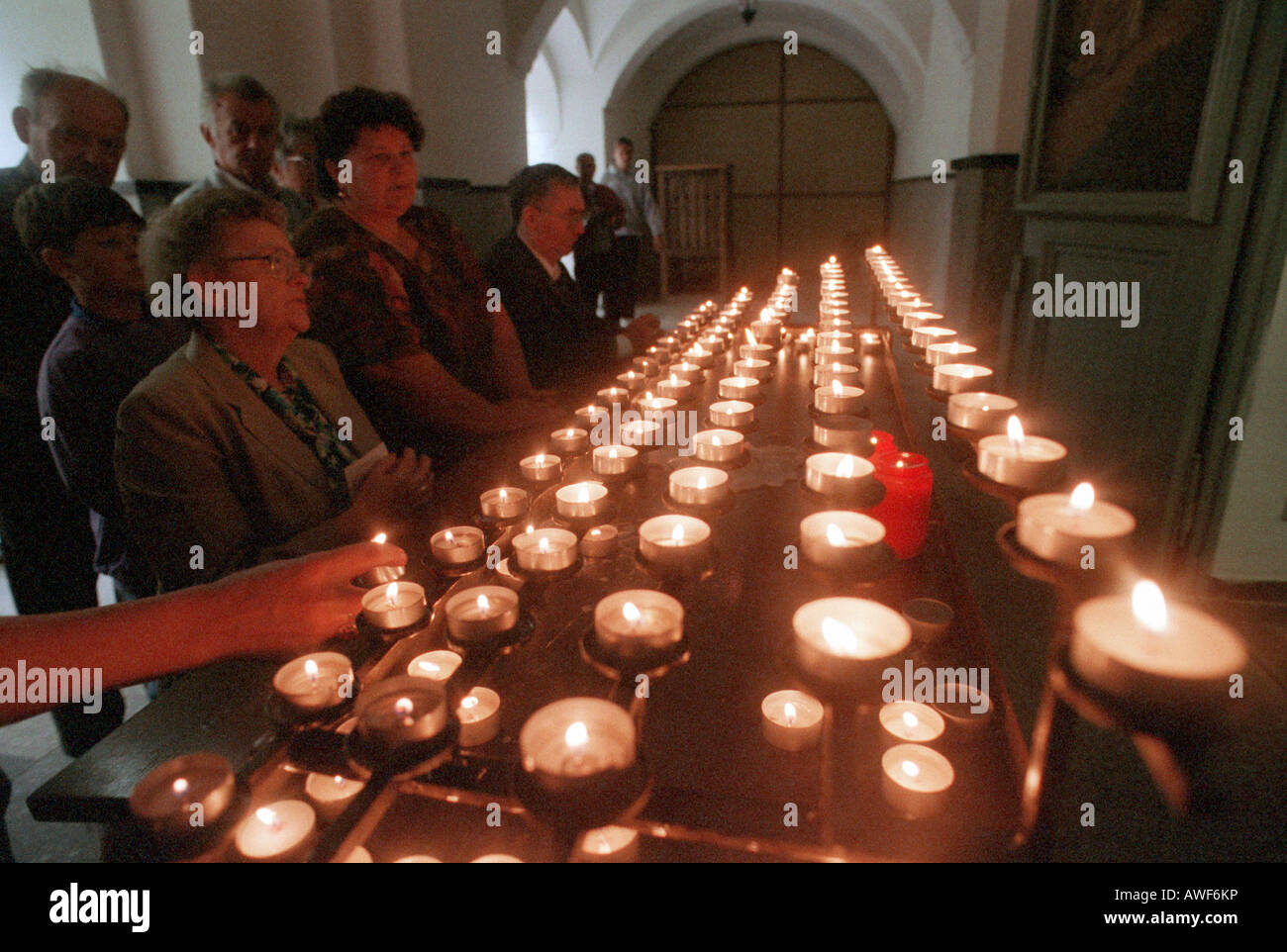 Believers lighting candles in a church, Gora Swietej Anny, Poland Stock ...
