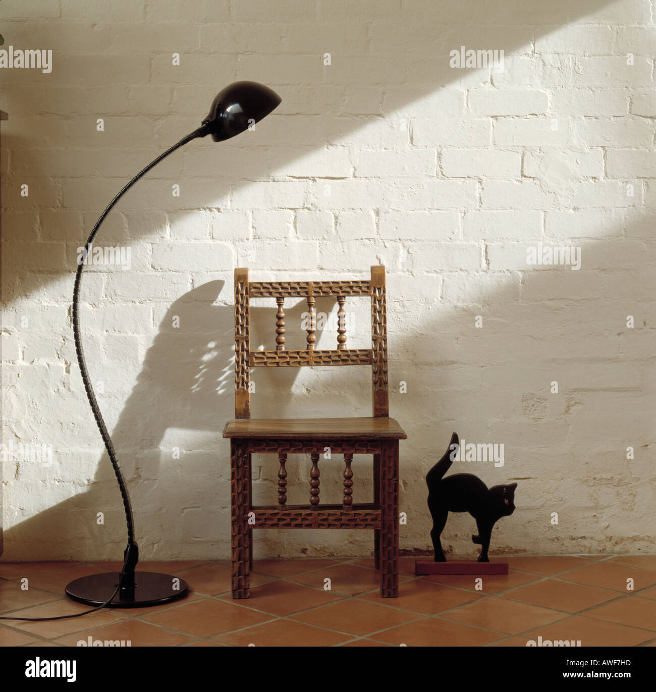 Modern lamp and chair Stock Photo - Alamy