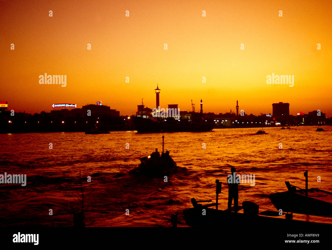 Dubai UAE Creek At Sunset Man Praying by the Creek Stock Photo - Alamy