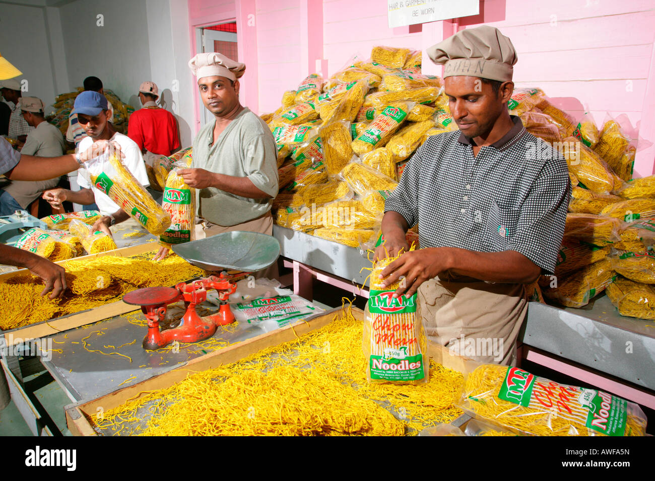 Woman working inside pasta factory hi-res stock photography and images ...