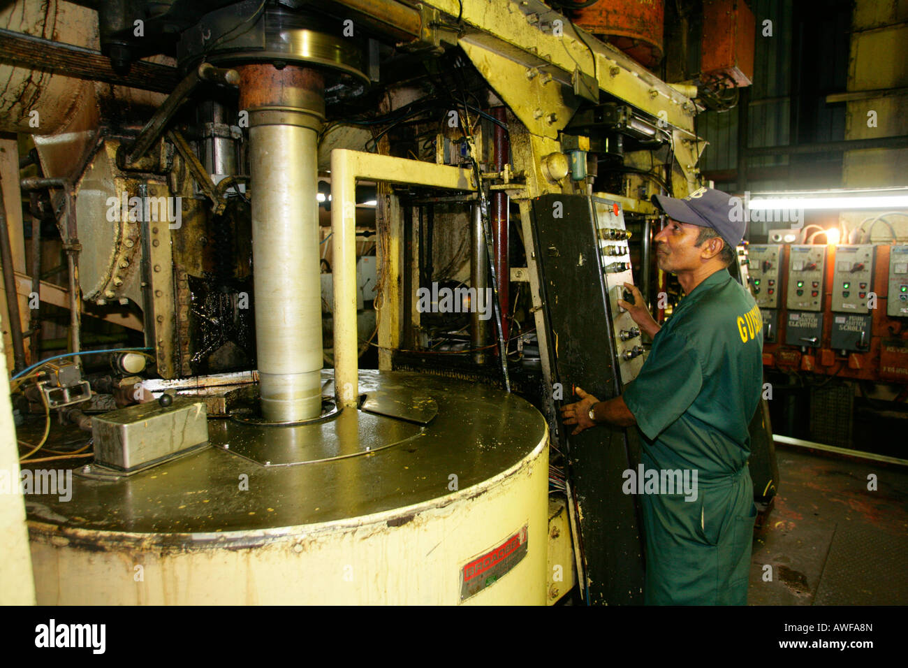 Worker checking sugar, production of "Demerara sugar" made from sugar ...