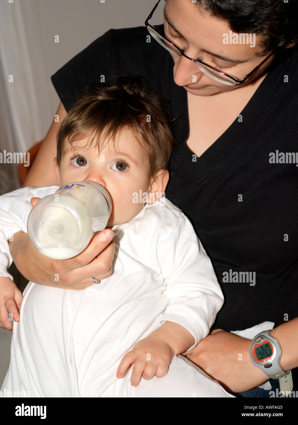Woman giving milk daughter hi-res stock photography and images - Alamy