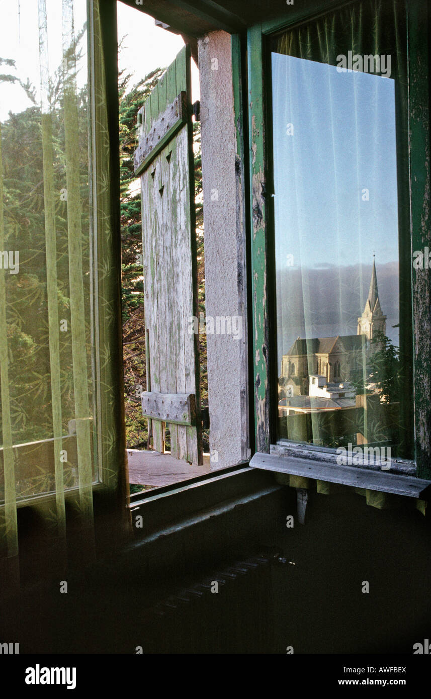 A church is reflected in an open window, Frutillar, Chile Stock Photo ...