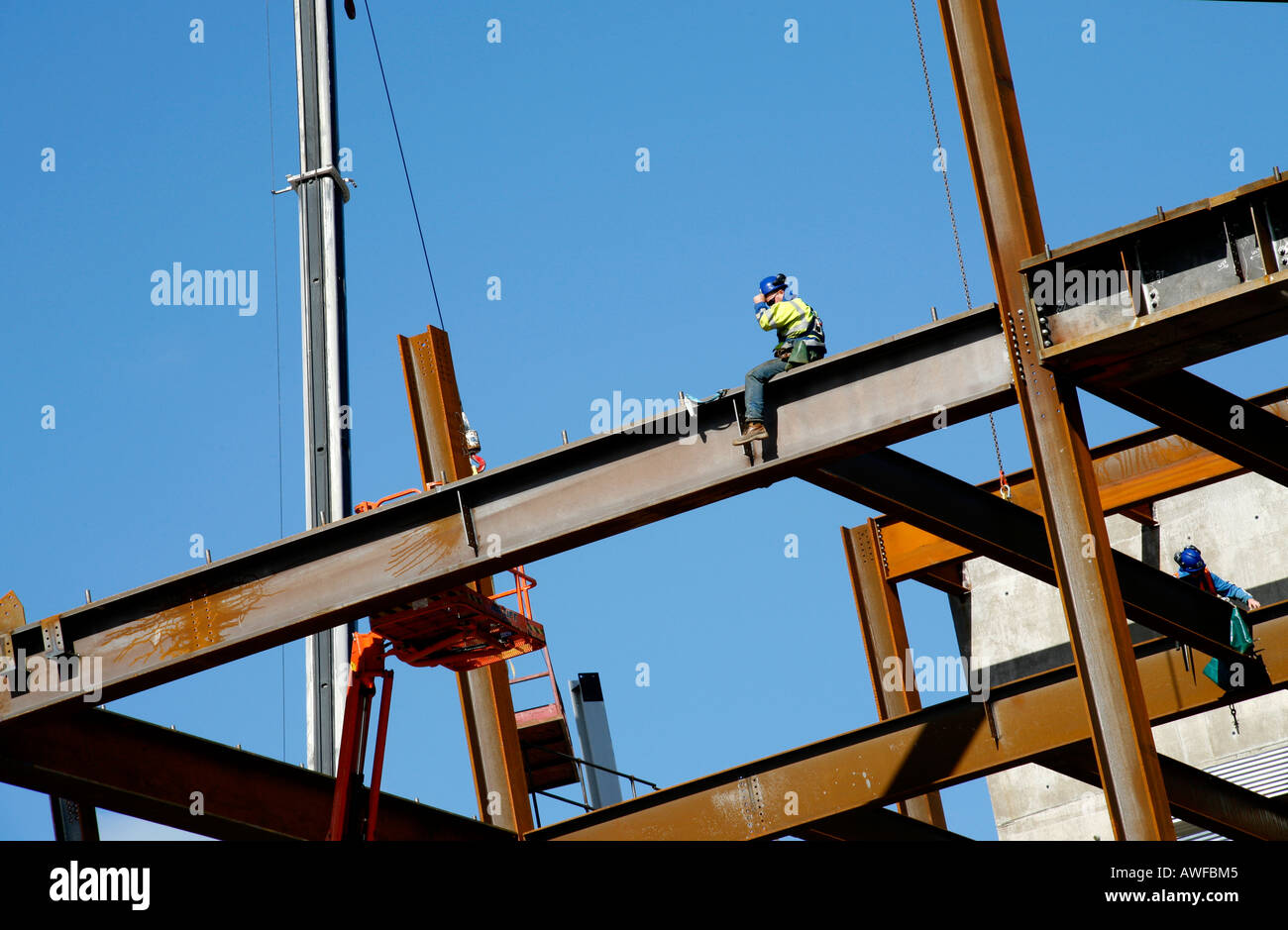 a construction worker sits high up on a steel girder Stock Photo - Alamy