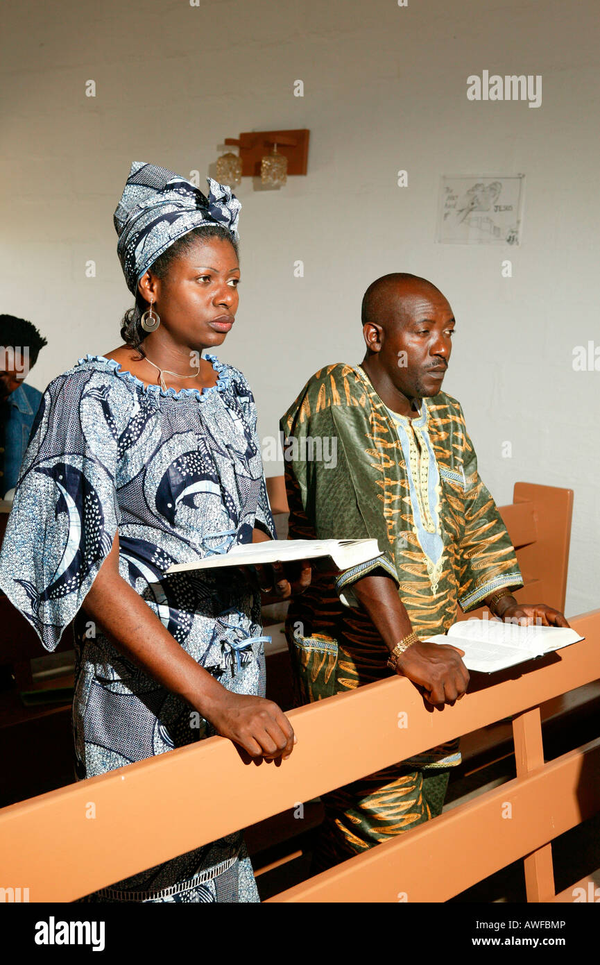 Couple wearing traditional clothing during mass, Francistown, Botswana ...