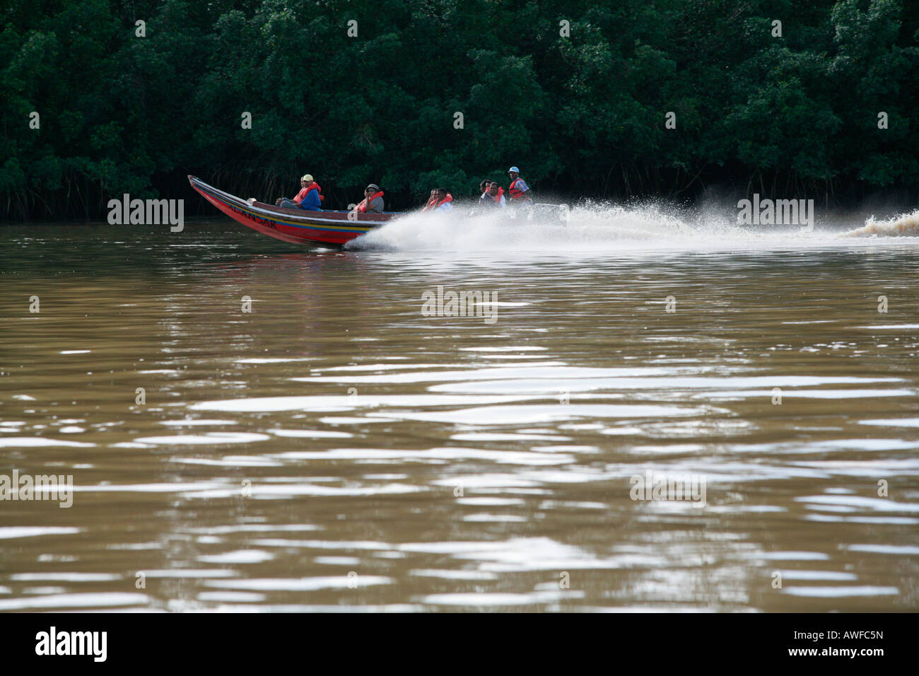 Speedboat carrying passengers, Demerara River, Georgetown, Guyana ...