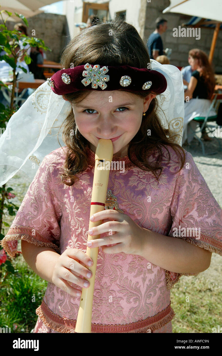 Girl playing recorder during a medieval festival, Burghausen, Upper ...