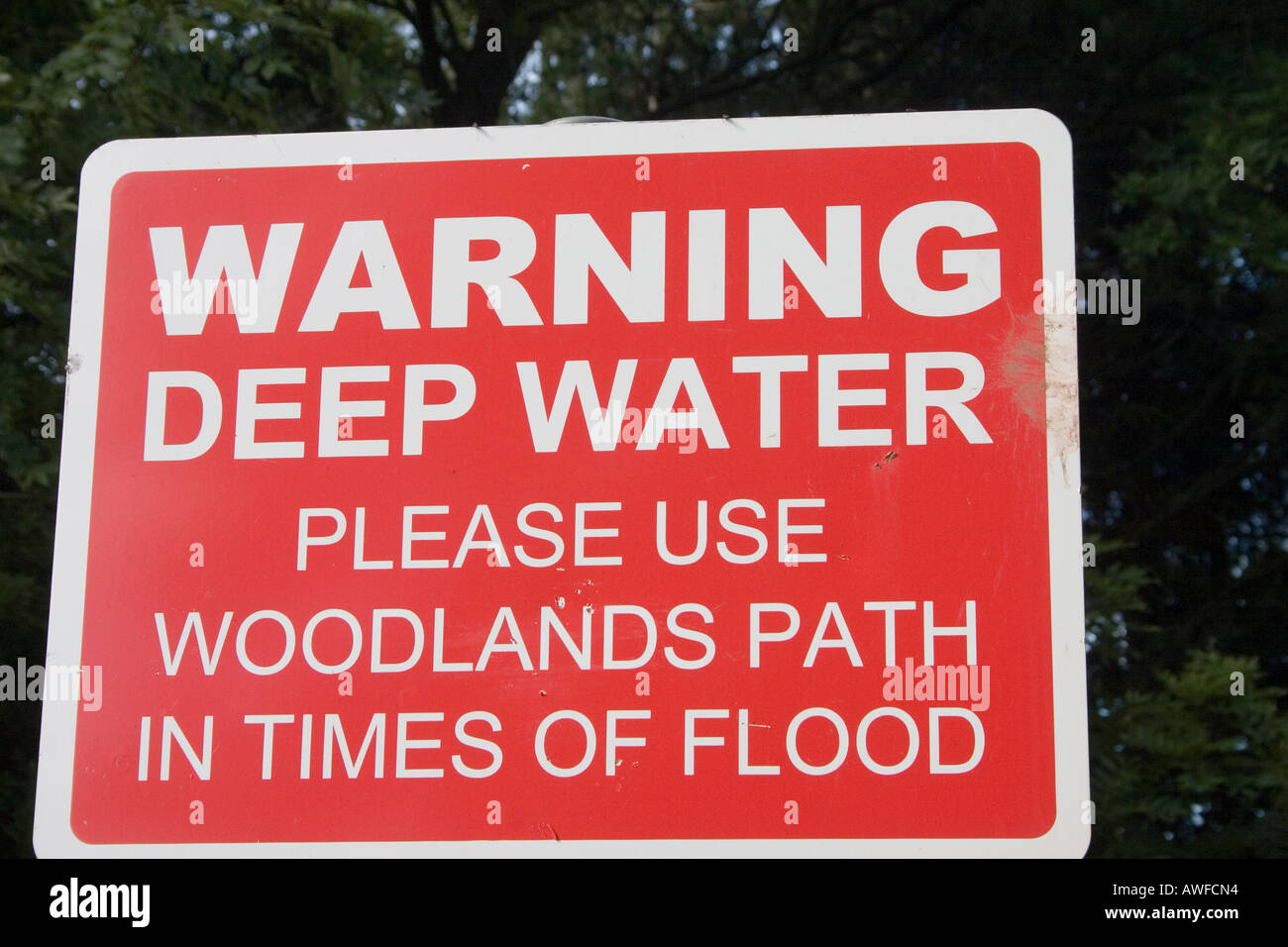 Flood warning sign on the footpath around Llanishen reservoir Cardiff ...