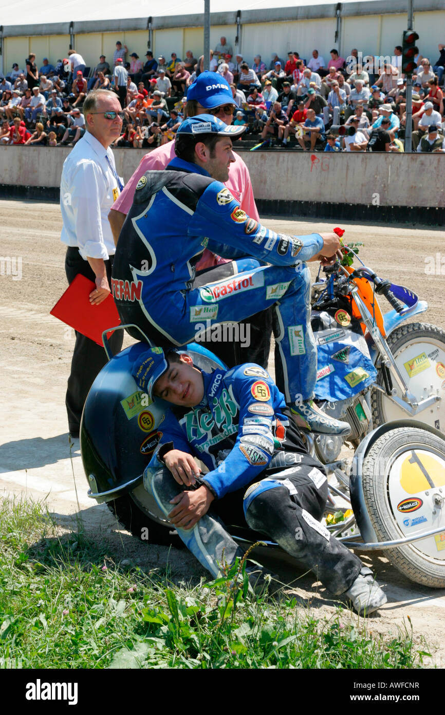 Sidecar motorcycle driver taking a break at an international motorcycle ...