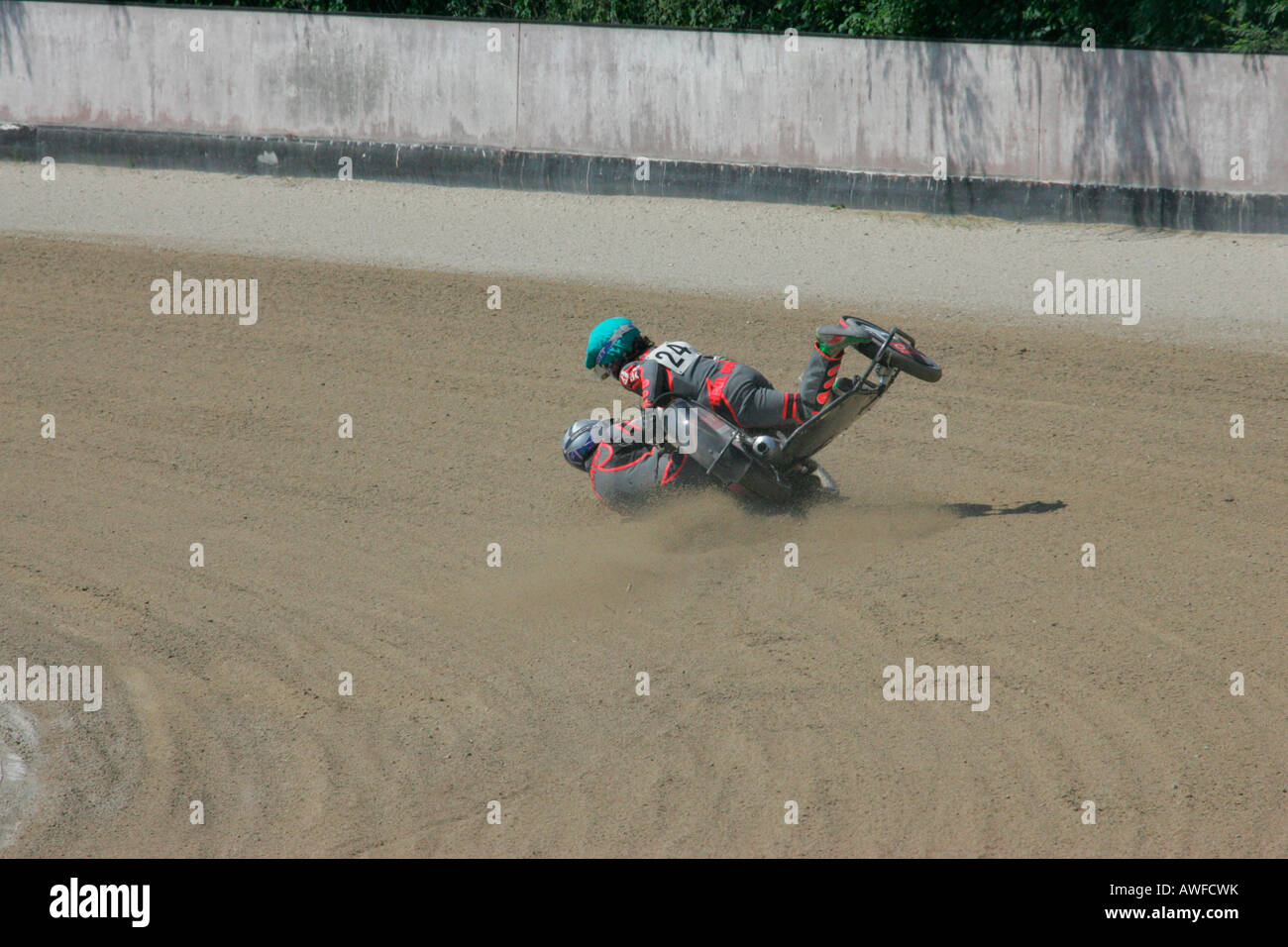 Sidecar motorcycle crash at an international motorcycle race on a dirt ...