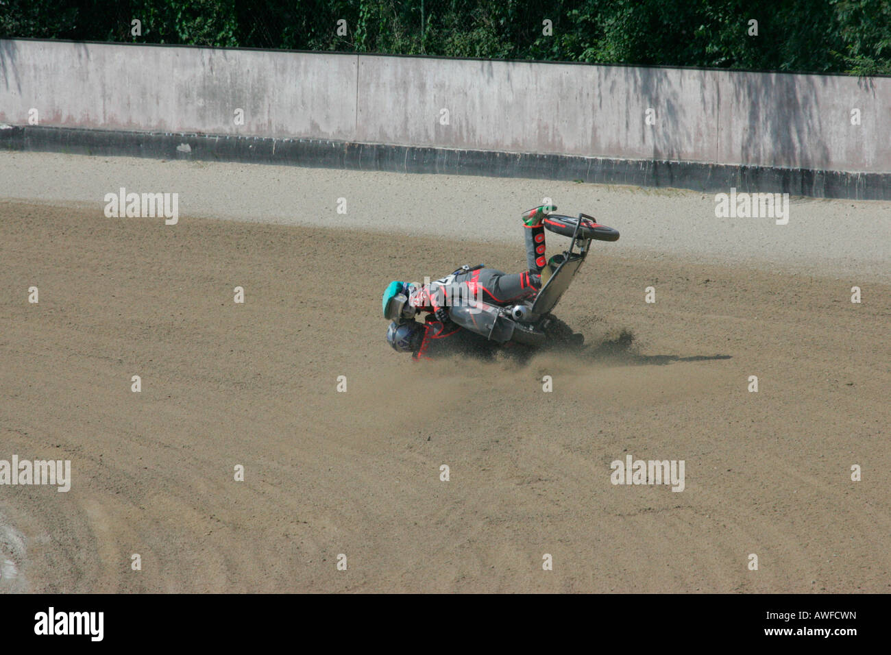 Sidecar motorcycle crash at an international motorcycle race on a dirt ...