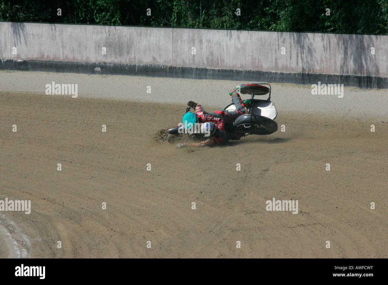 Sidecar motorcycle crash at an international motorcycle race on a dirt ...