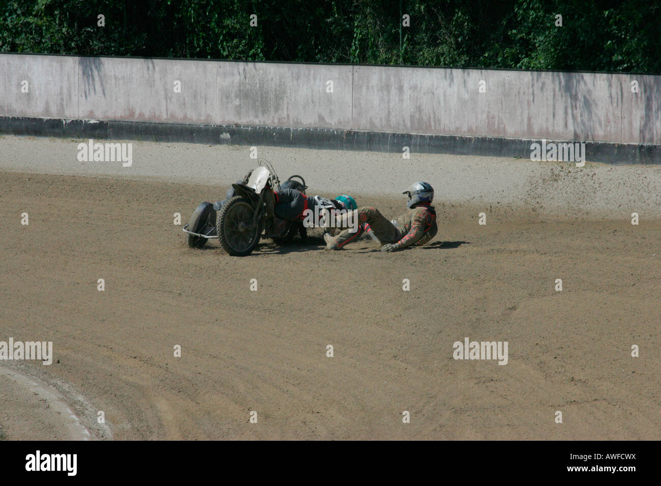 Sidecar motorcycle crash at an international motorcycle race on a dirt ...
