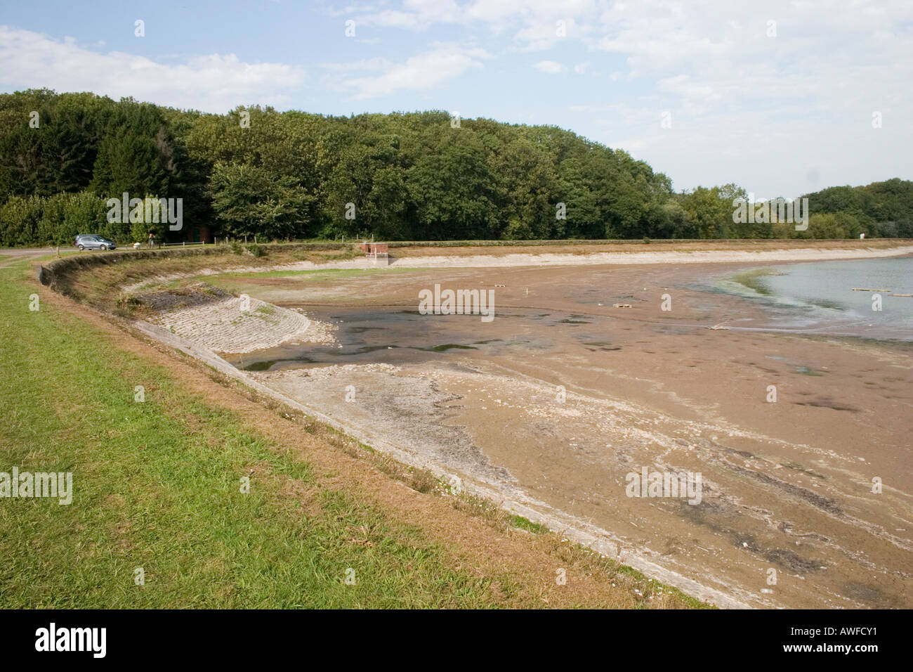 Water trickling into a depleted Lisvane reservoir in mid summer Cardiff ...