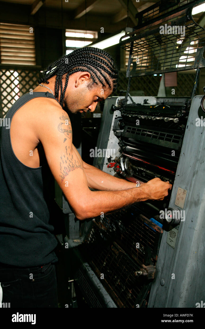 Printer cleaning a printing press at the Catholic Standard printing ...