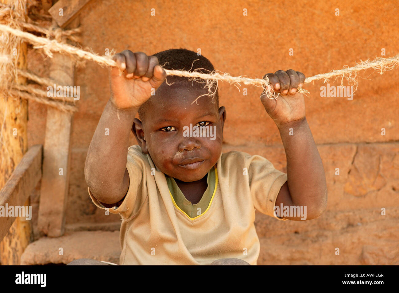 Boy clutching a rope, Cameroon, Africa Stock Photo - Alamy