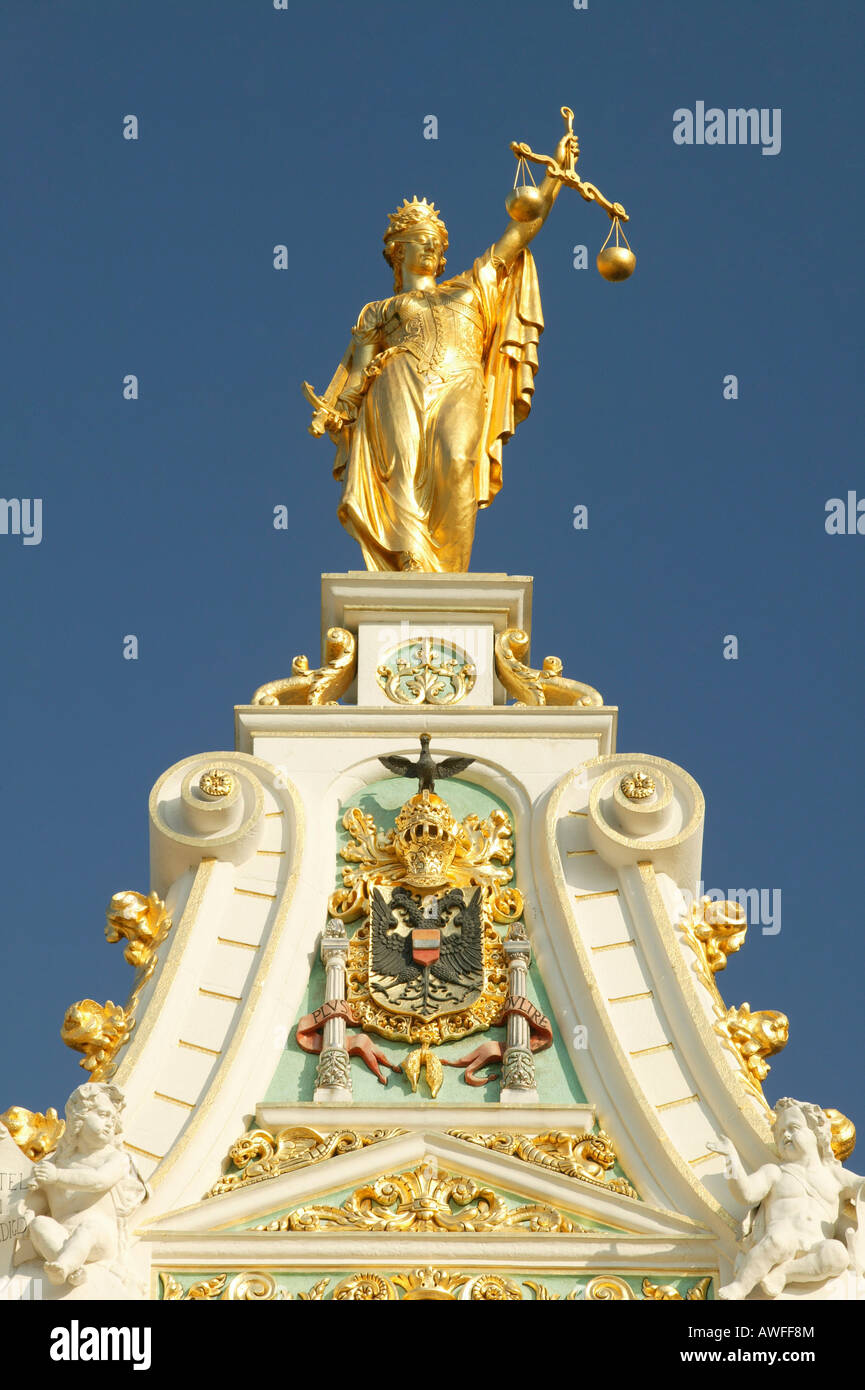 Statue of Justice with scales and sword on the gable of the courthouse ...