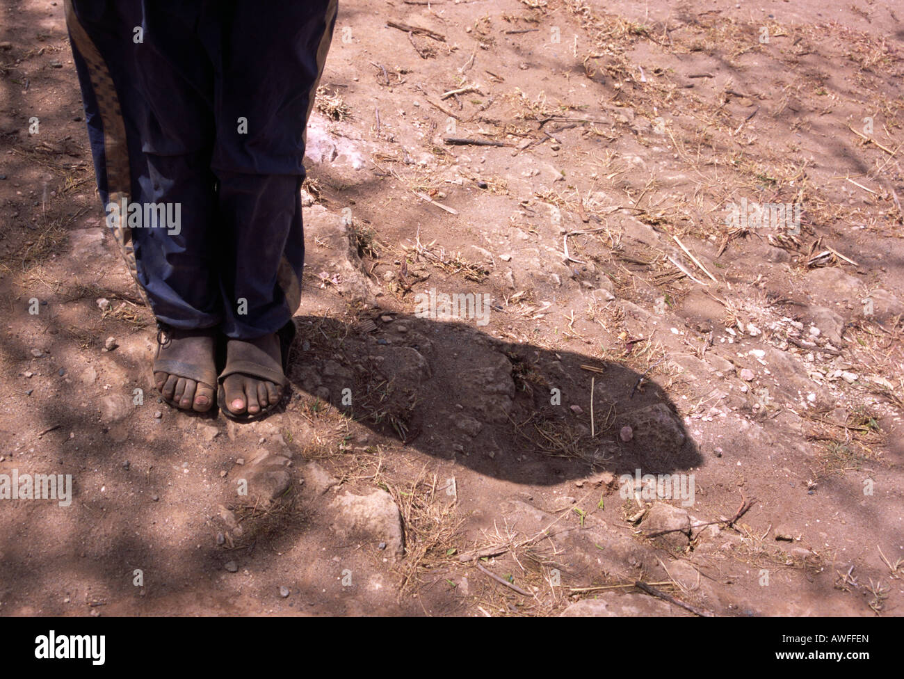 Legs of a boy standing to attention in the desert, Ethiopia, Africa ...