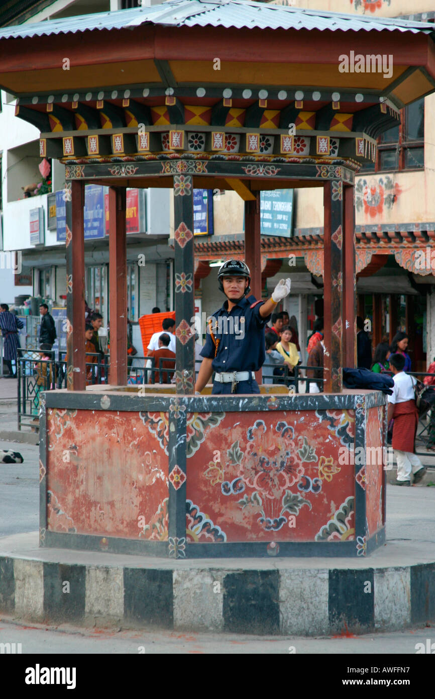A policeman directing the traffic in the main road of Thimphu, the only ...