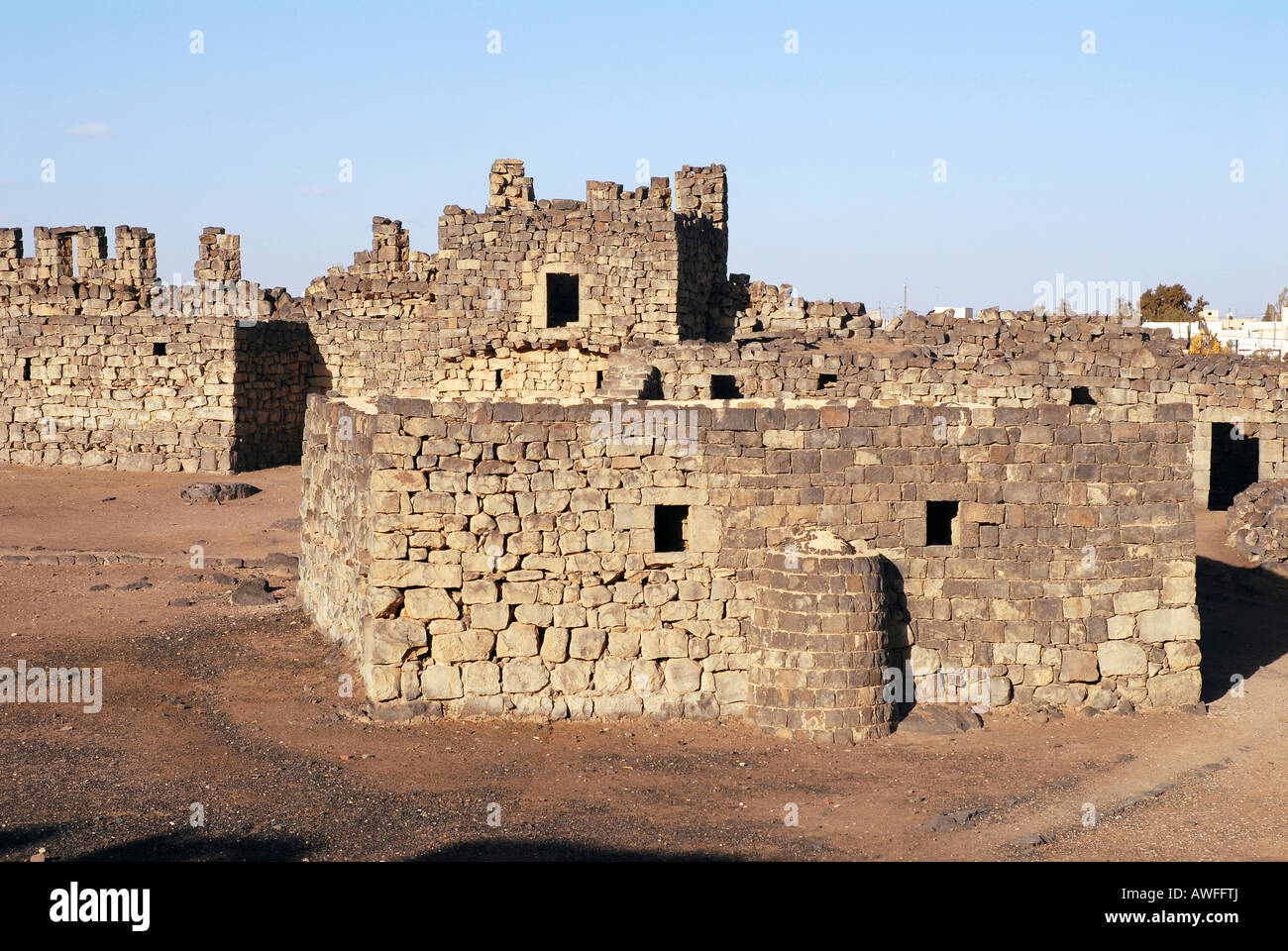 Ruins of the desert castle Qasr Azraq with mosque, Jordan Stock Photo ...