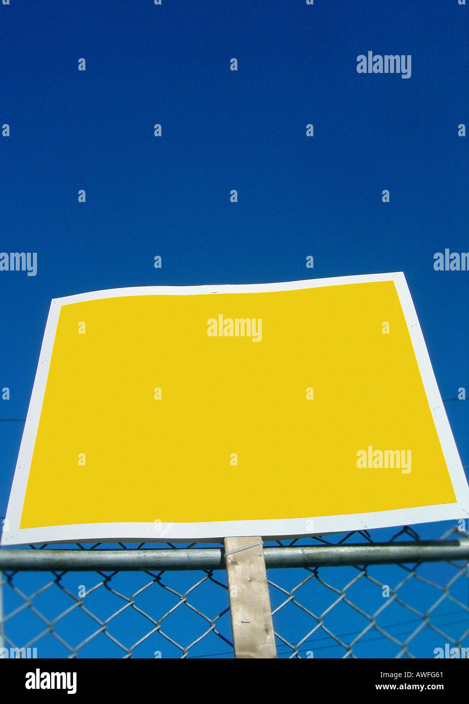 Urban Scene of a Blank Yellow Sign Against a Clear Blue Sky Copy Space ...