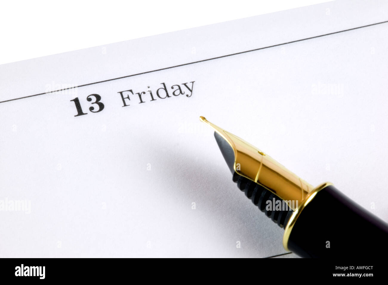Friday 13th on a diary page with a gold nibbed fountain pen Stock Photo ...