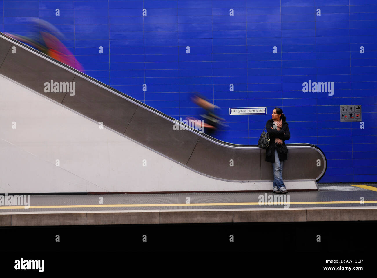 Woman leaning against rail hi-res stock photography and images - Alamy