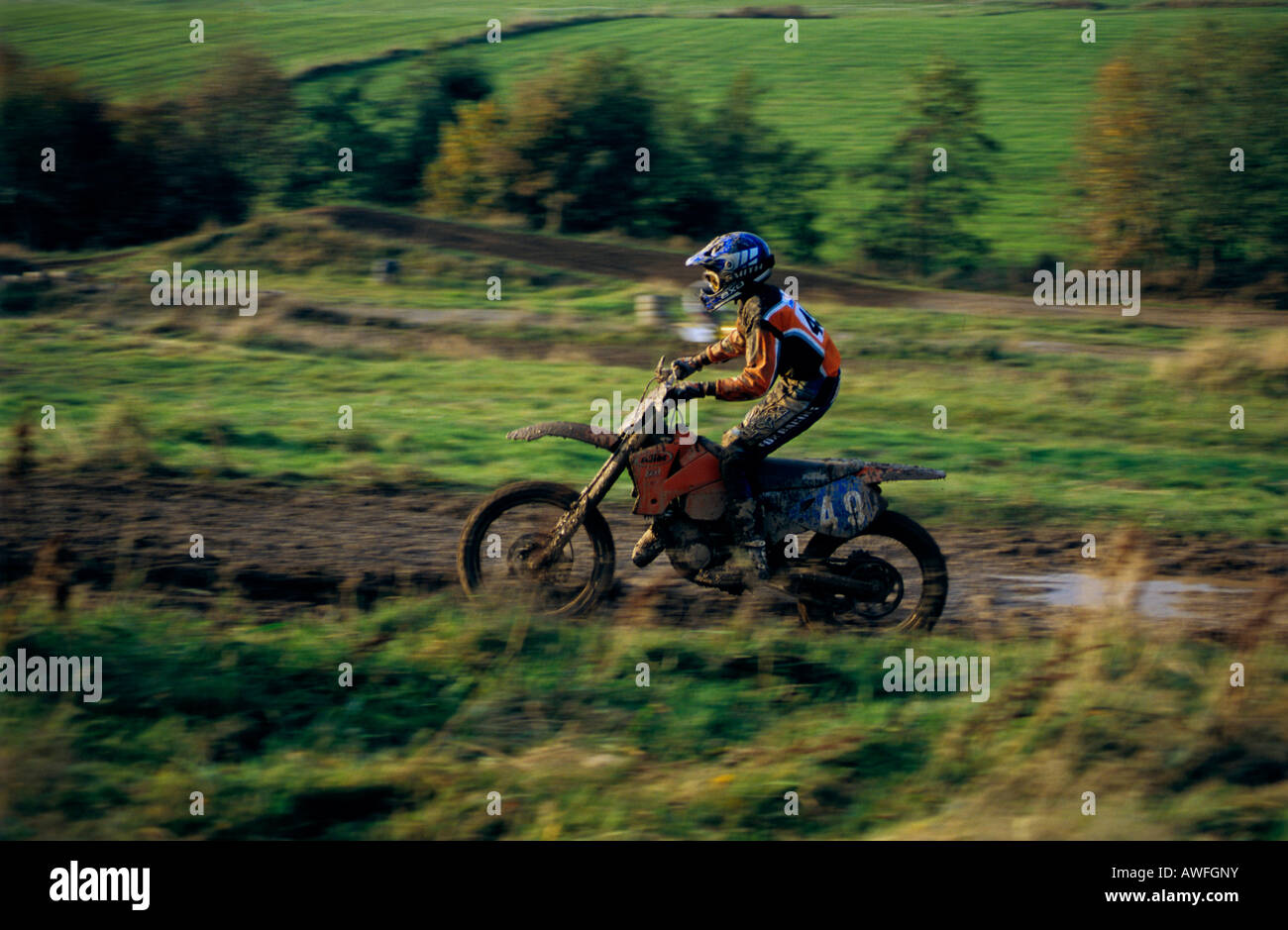 Motocross driver on an off-road ride Stock Photo - Alamy