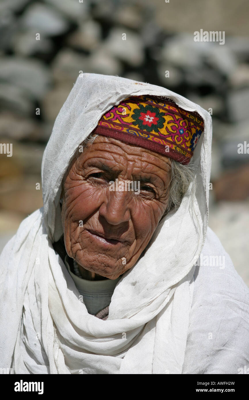 ismaili muslim sheperdess in the meadows above batura glacier near pasu ...