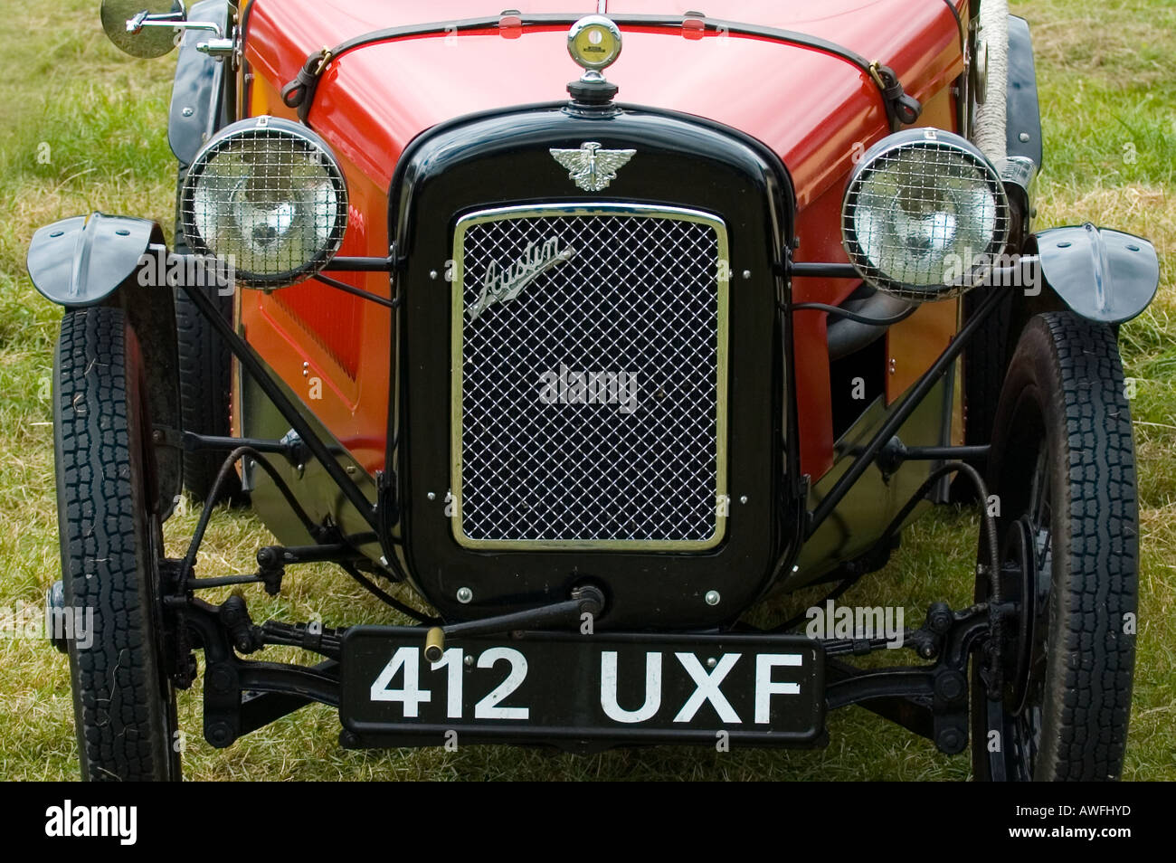 Old red Austin car viewed from the front Stock Photo - Alamy