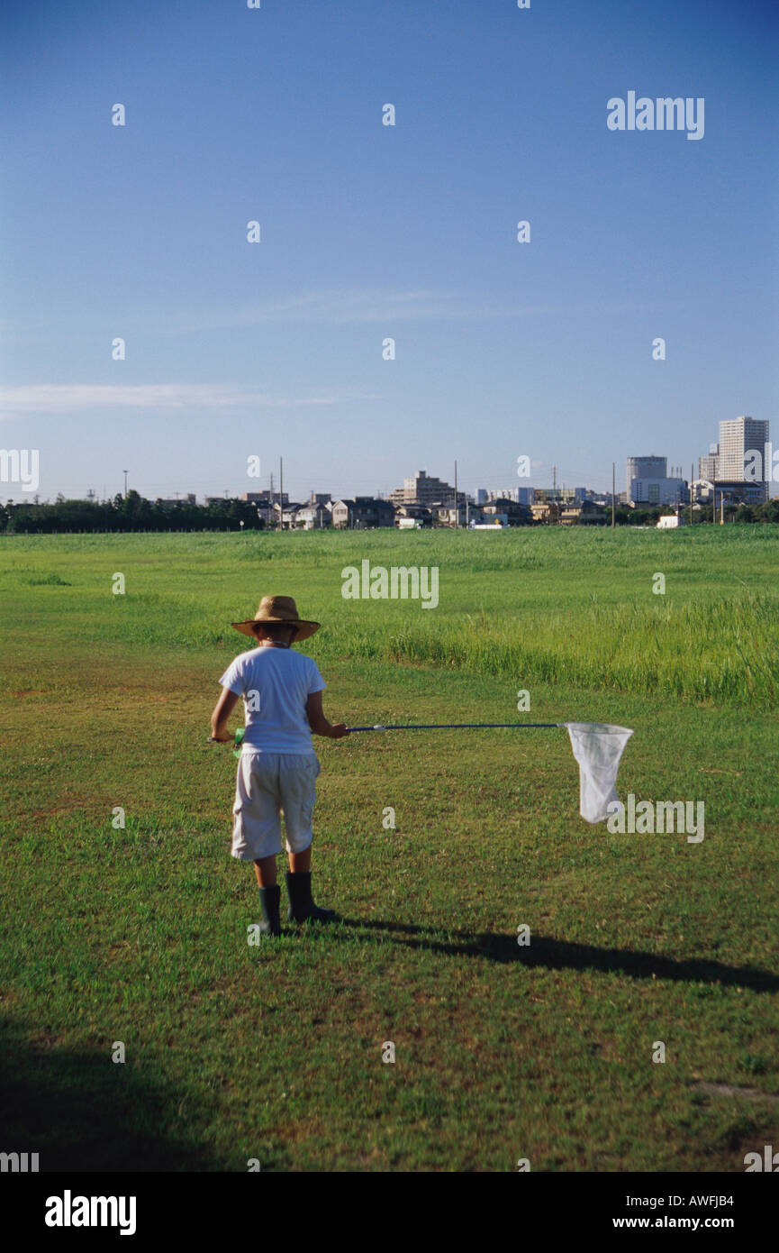 Child searching for insects hi-res stock photography and images - Alamy