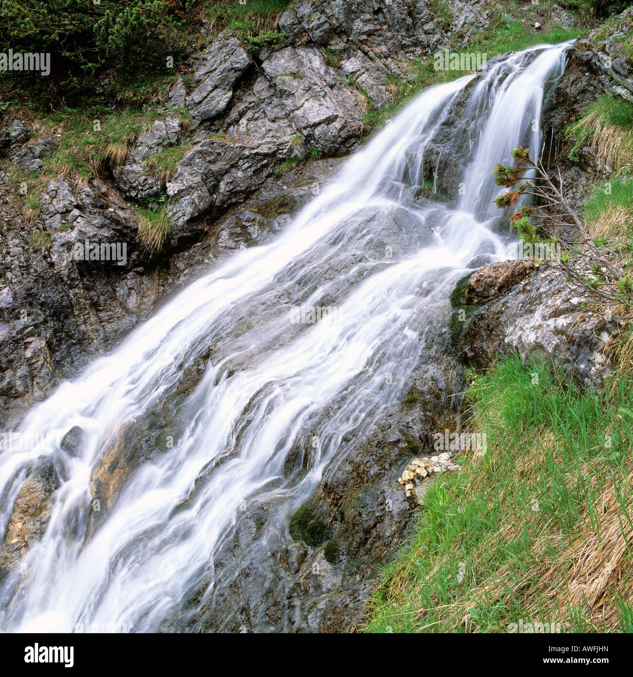 Small waterfall in a mountain stream, movement Stock Photo - Alamy