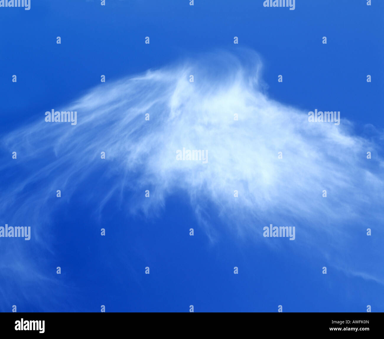 Ghost-shaped cirrus cloud in a blue sky Stock Photo - Alamy